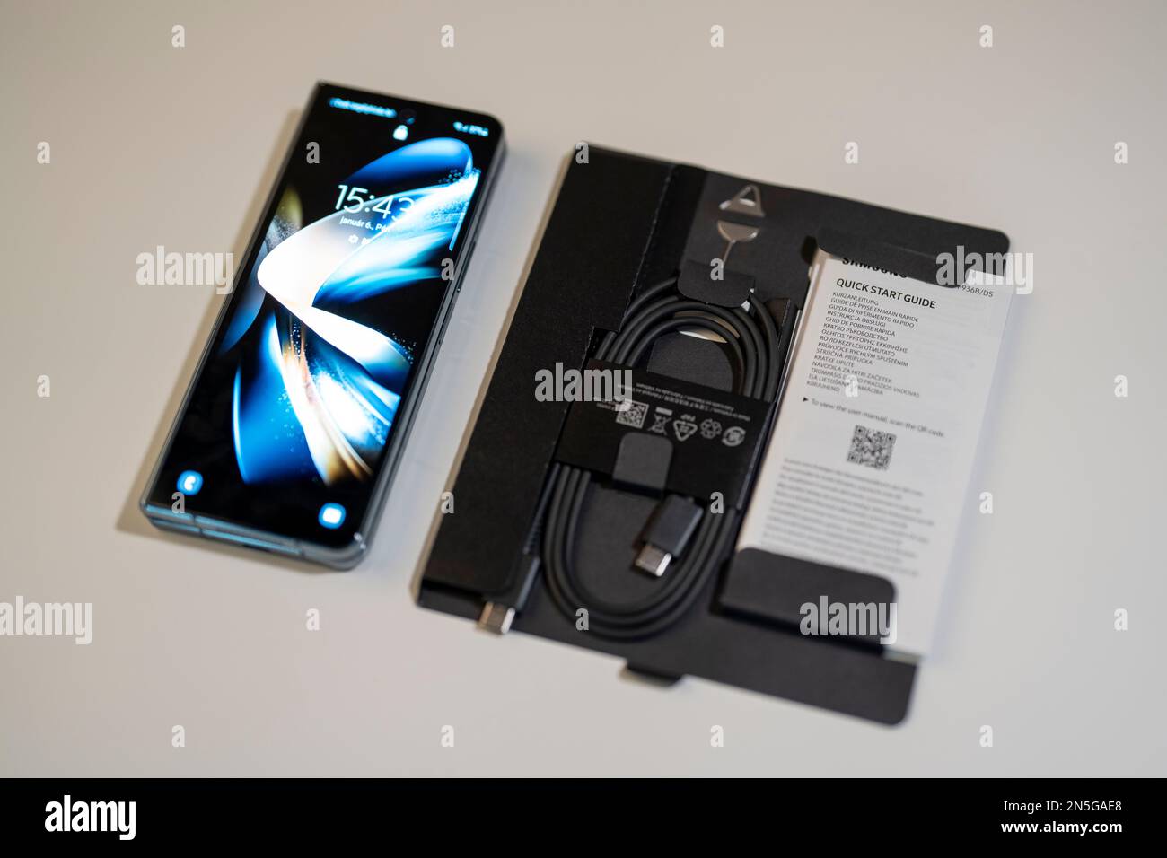 Samsung Galaxy Z Fold 4 in grey-green color. The device is in the ...