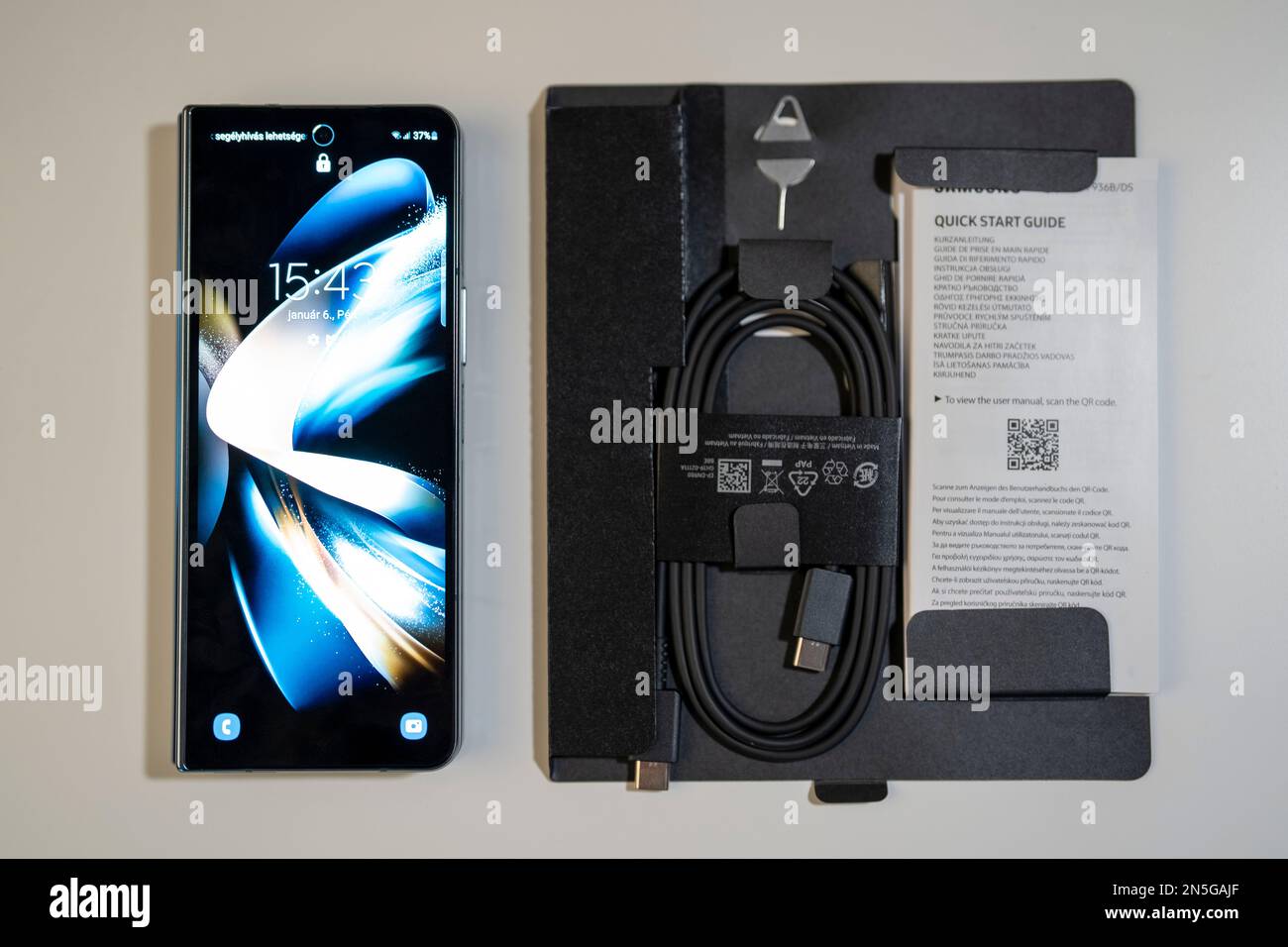 Samsung Galaxy Z Fold 4 in grey-green color. The device is in the ...