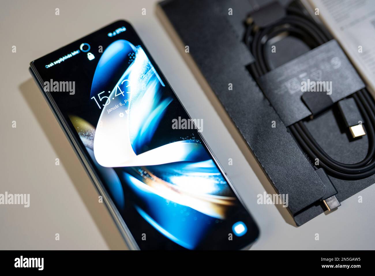 Samsung Galaxy Z Fold 4 in grey-green color. The device is in the ...