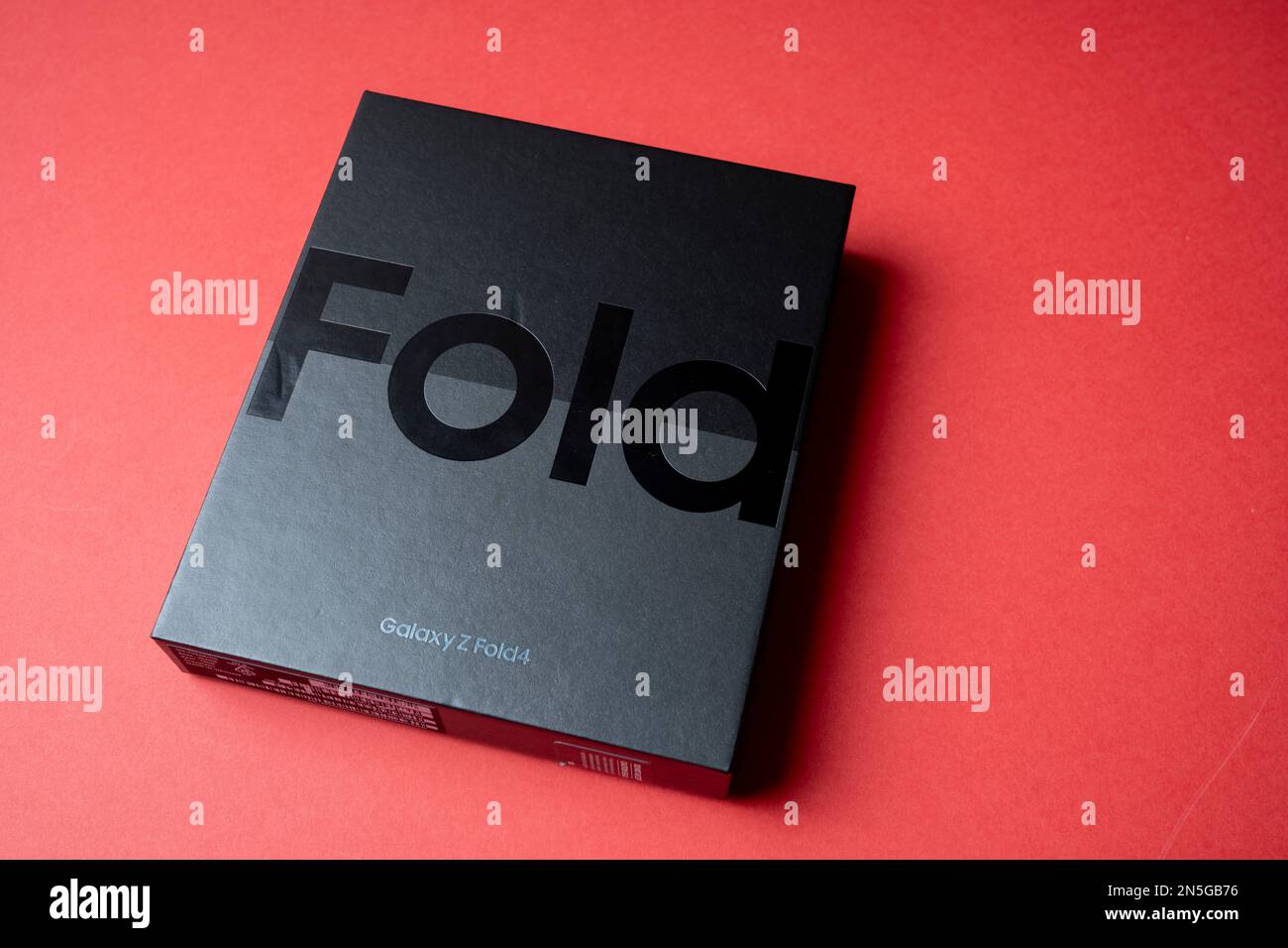 Brand new Samsung Galaxy Z Fold 4 in original box. Against a red ...