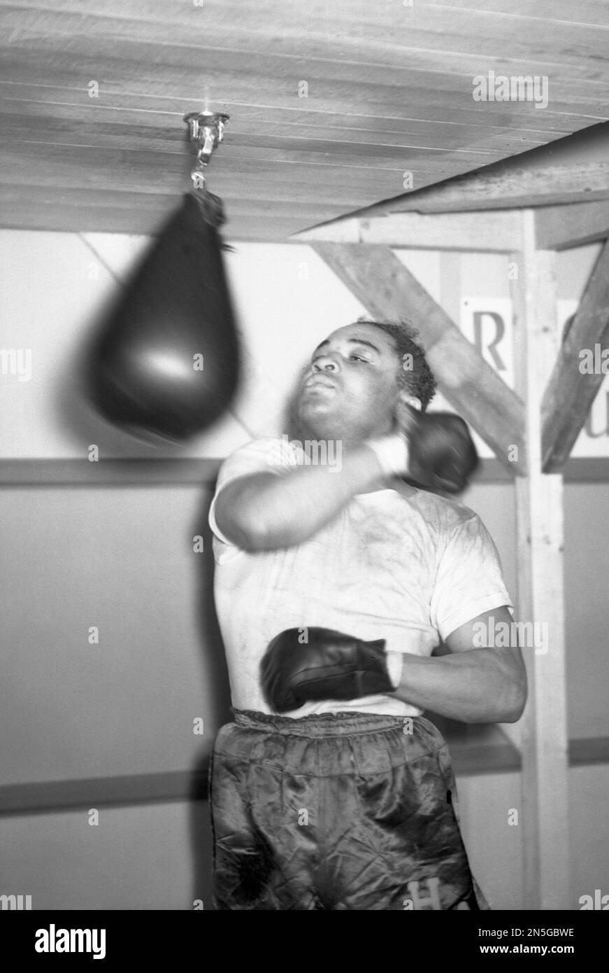 American World Welterweight Champion Henry Armstrong gives the punch ...