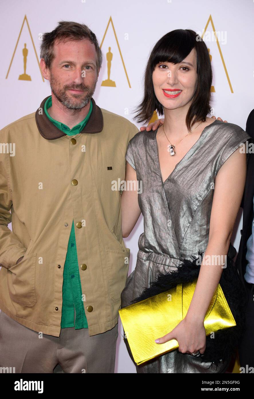 Spike Jonze, left, and Karen O arrive at the 86th Oscars Nominees ...