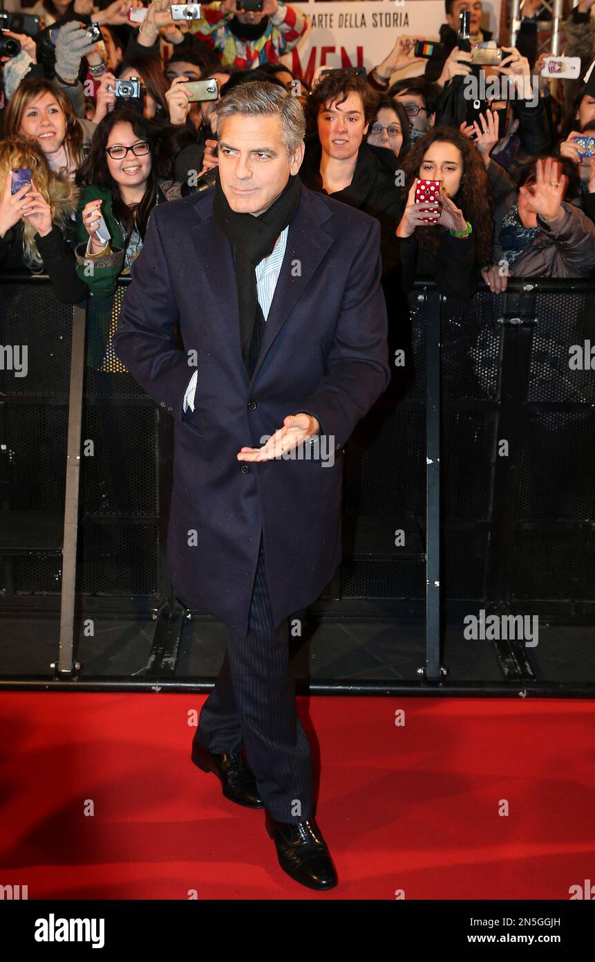 American actor George Clooney poses for photographers on the red carpet ...