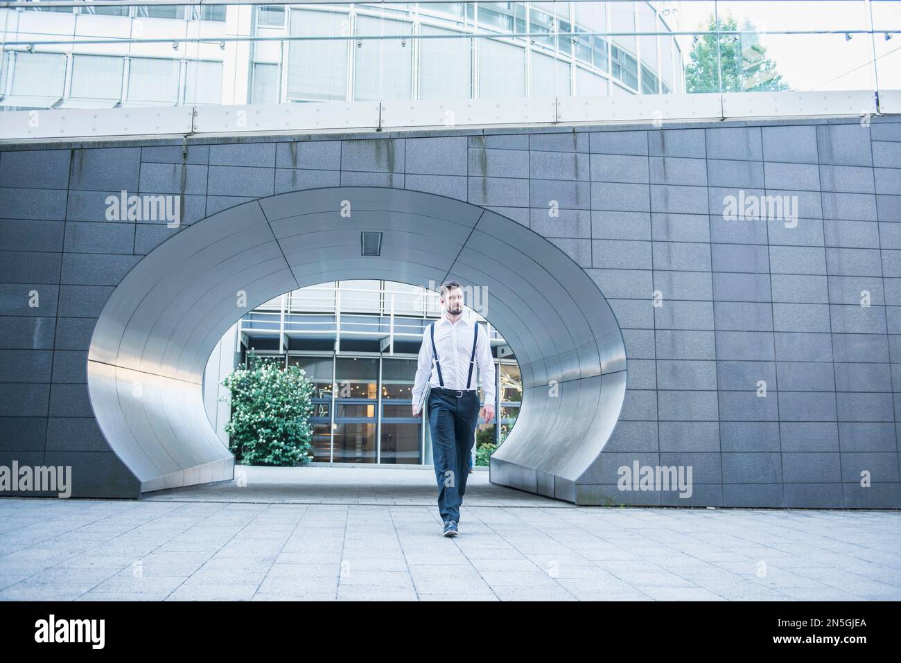 Professional man walking laptop computer hi-res stock photography and ...