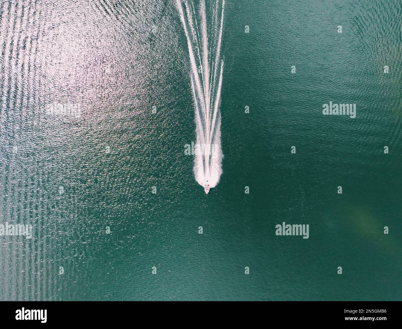 Aerial image over boat driving on water Stock Photo - Alamy