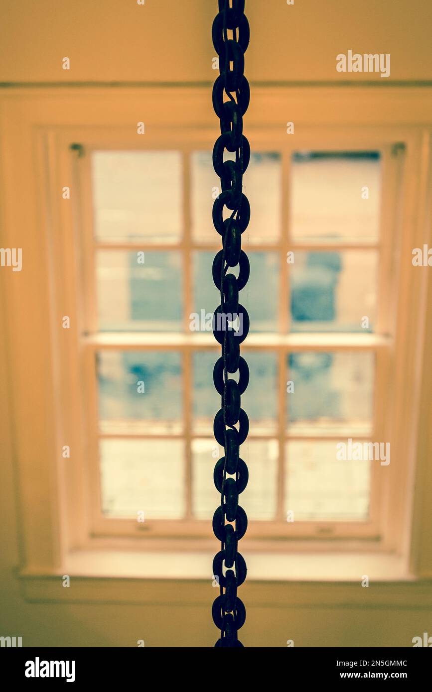 Heavy metal chain hanging in front of a window, Washington D.C., USA ...