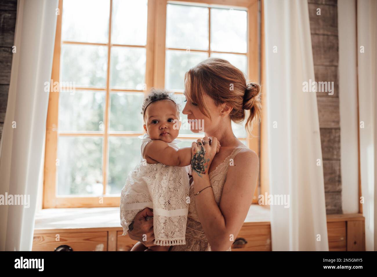 Diverse people portrait of mother with swarthy infant spending time at ...