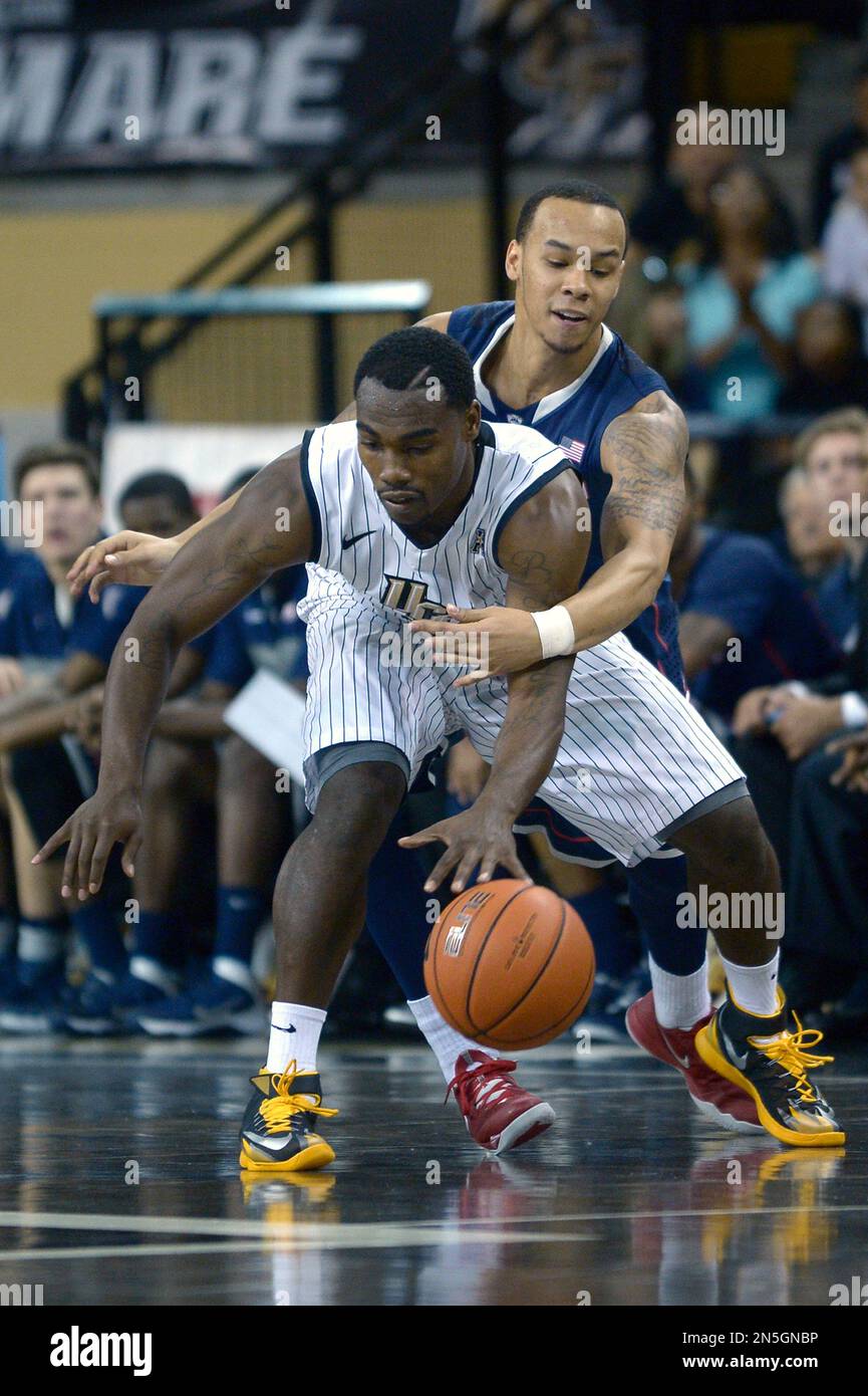 Connecticut guard Shabazz Napier, right, knocks the ball away from ...