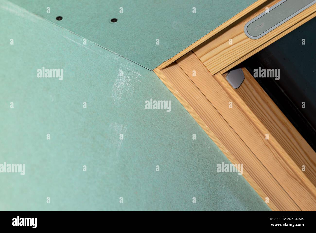 Mounted green plasterboards to an aluminum loft frame, roof window ...