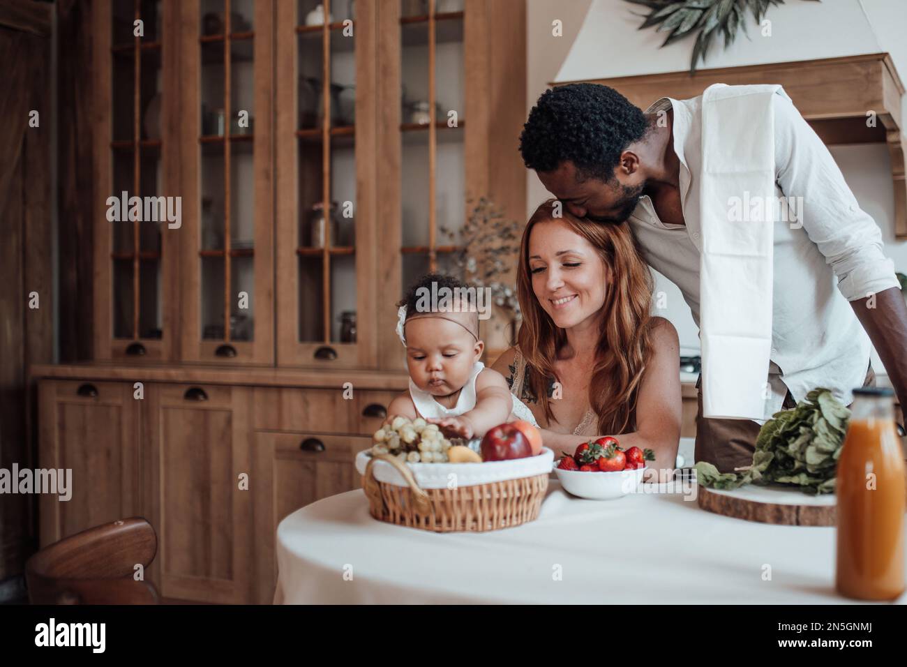 Mixed race family with white son infant swarthy daughter spend time ...