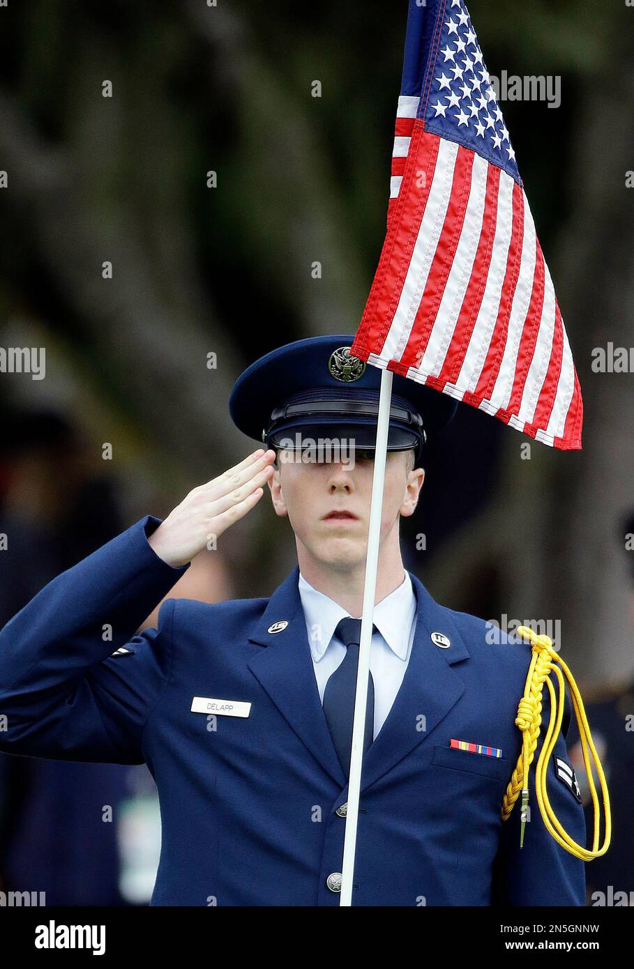 United States Air Force Airman 1st Class Joshua Delapp salutes a U.S ...