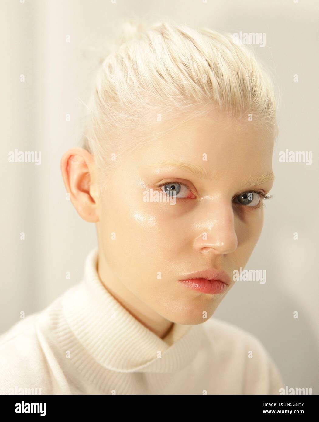 Ola Rudnicka of Poland has her make-up done before the Fall 2014 Diane ...