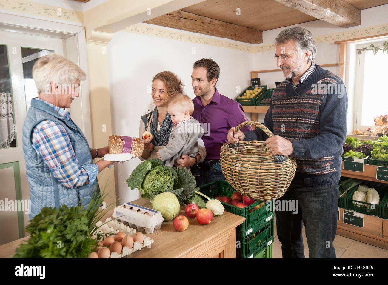Farmer selling bread to a family, Bavaria, Germany Stock Photo - Alamy
