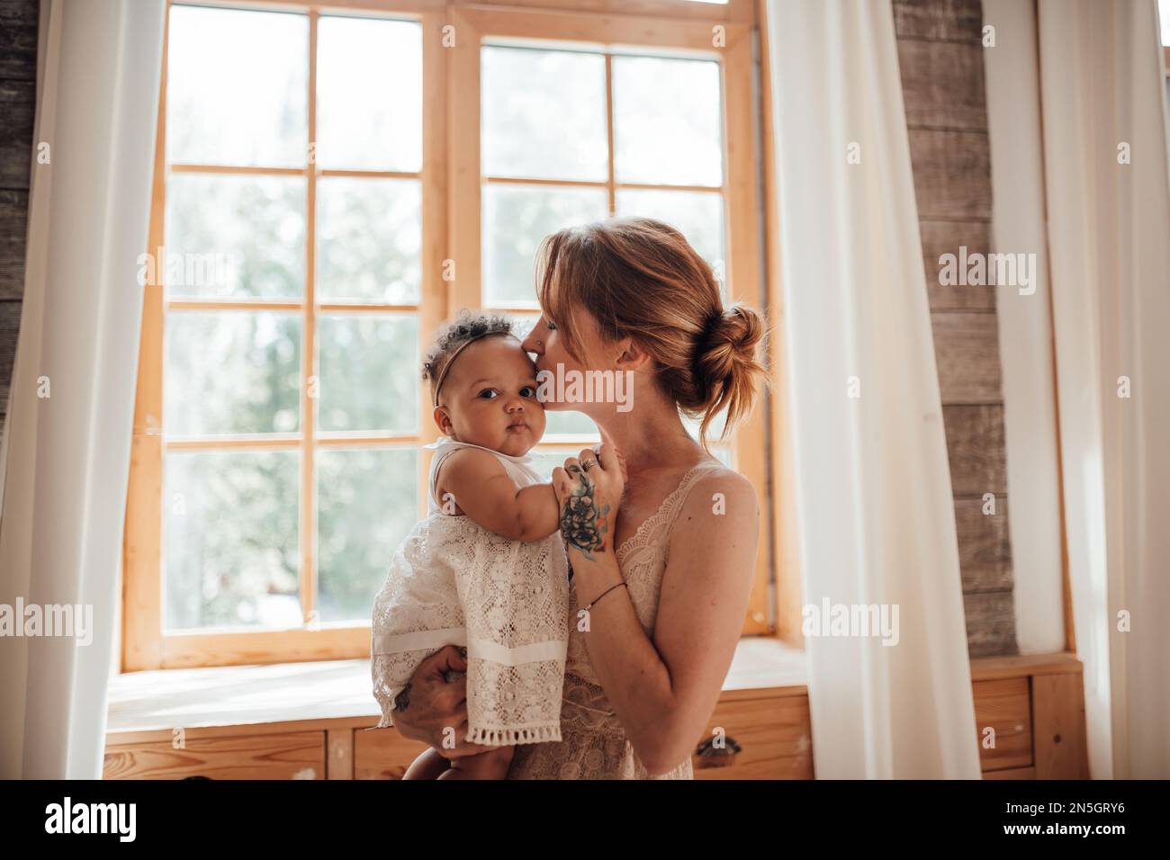 Diverse people portrait of mother with swarthy infant spending time at ...