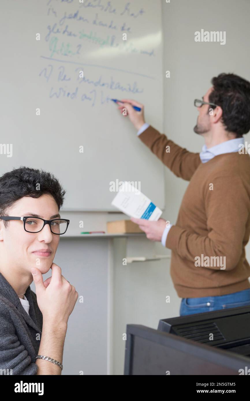 Teacher giving lecture in classroom School, Bavaria, Germany Stock ...