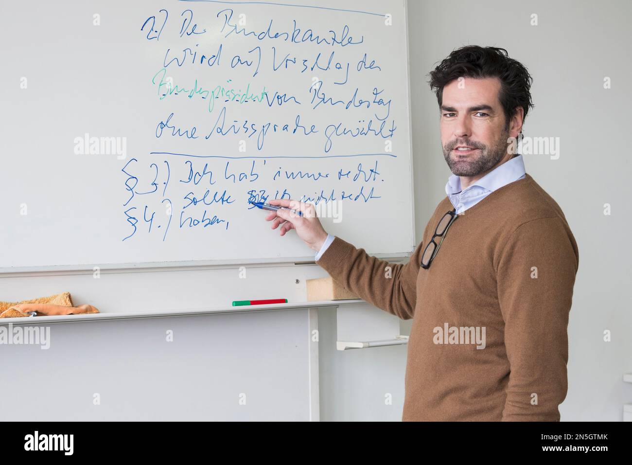 Teacher explaining on whiteboard School, Bavaria, Germany Stock Photo ...
