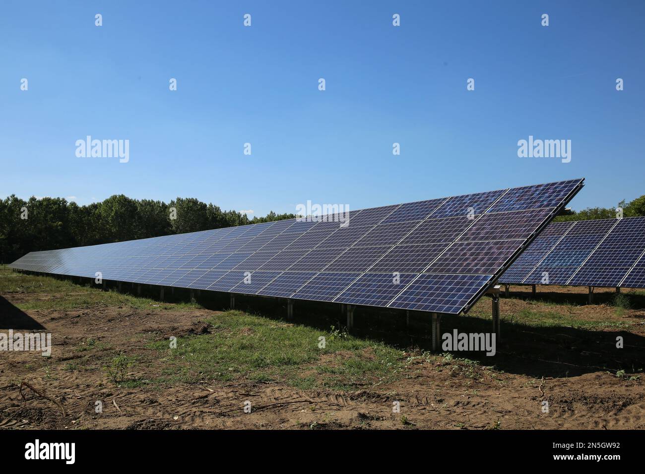 Line of solar power plant panels. Renewable energy. Solar plant panel ...