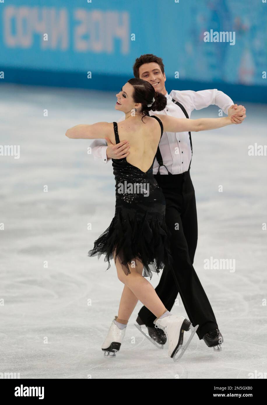 Tessa Virtue and Scott Moir of Canada compete in the team ice dance ...