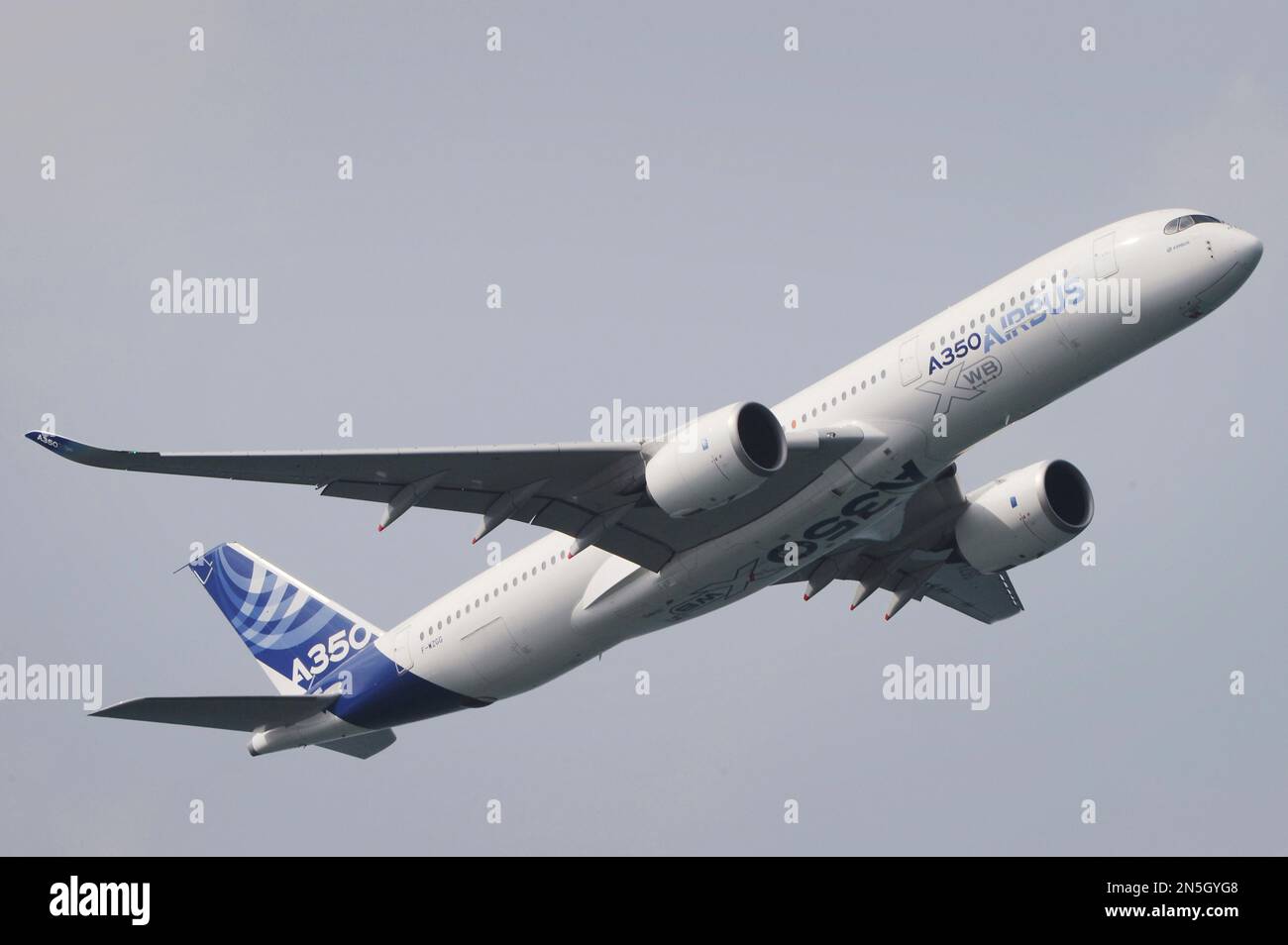 An Airbus A350-900 flies during an aerial display for a media preview ...