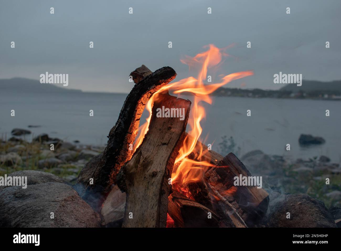 Inviting campfire on the beach during the summer, bring back fond ...