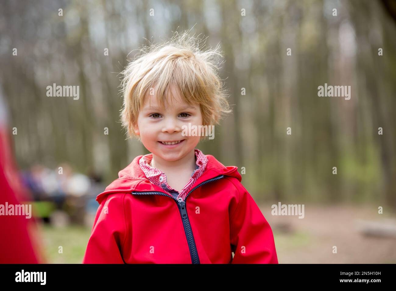 Little boy, learning how to ride a bike in the park, springtime Stock ...