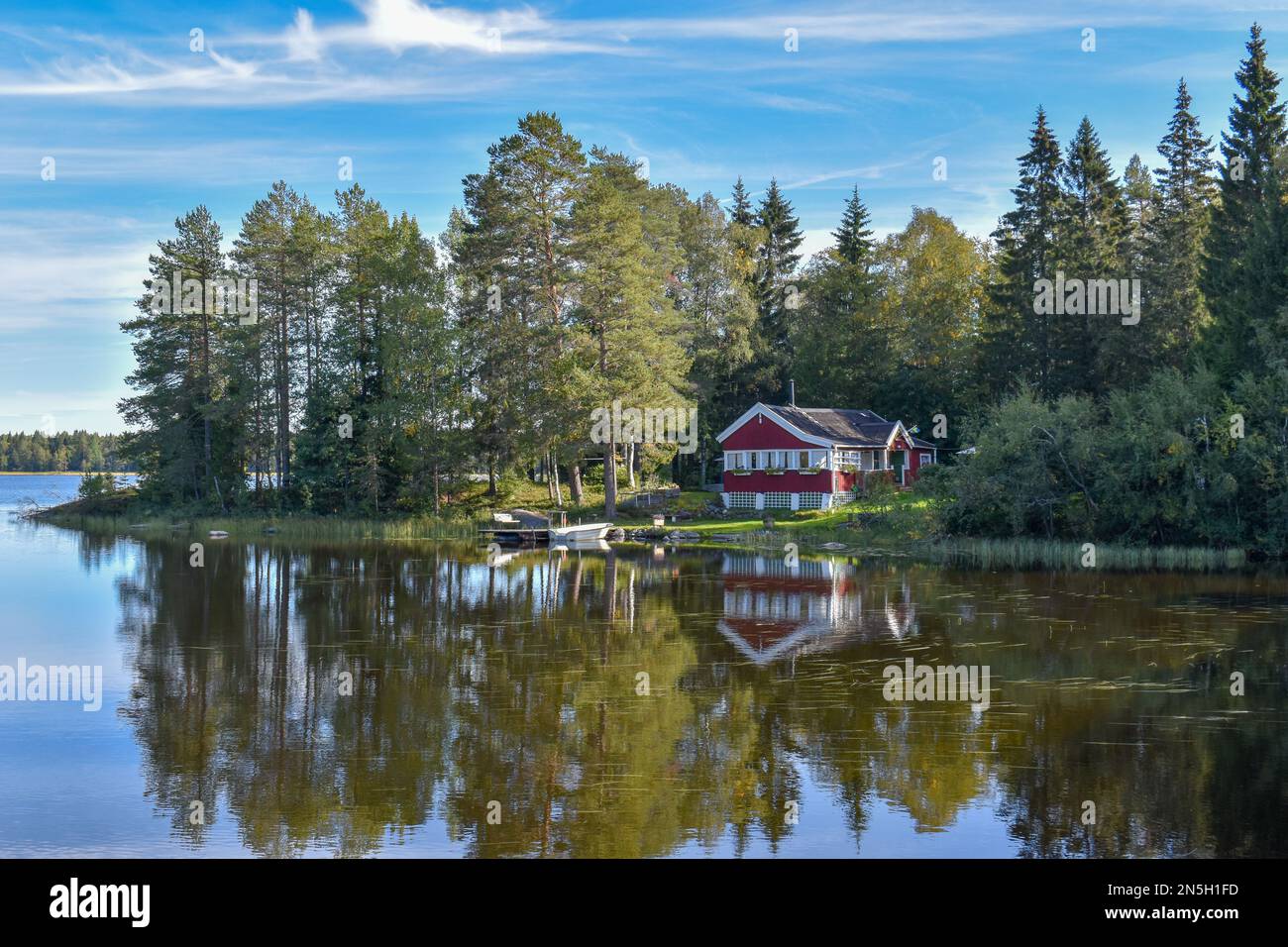 Autumn in Sweden - traditional red little cabin at a lake. By Lake ...
