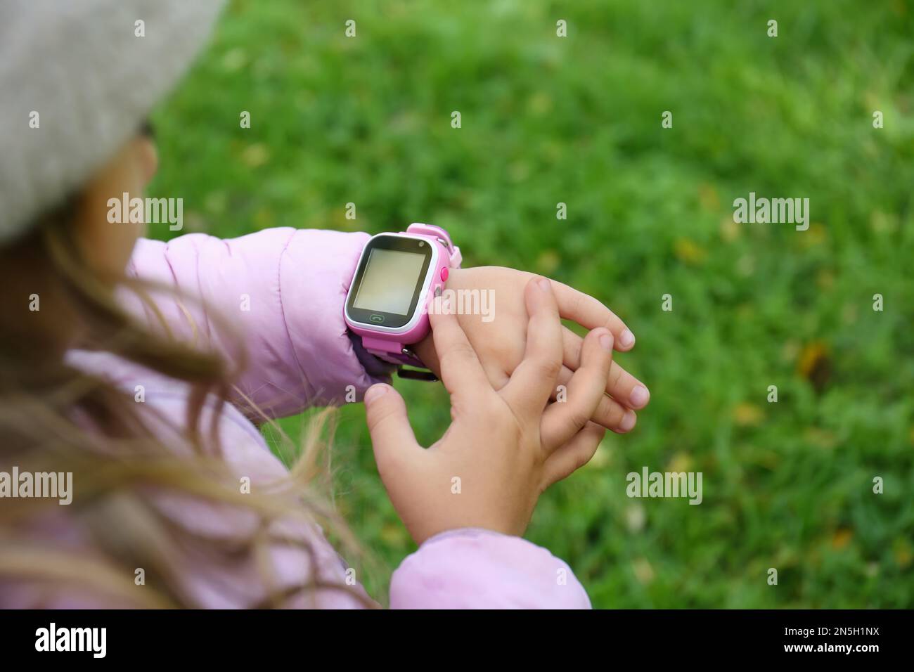 Little girl time wrist watch hi-res stock photography and images - Alamy