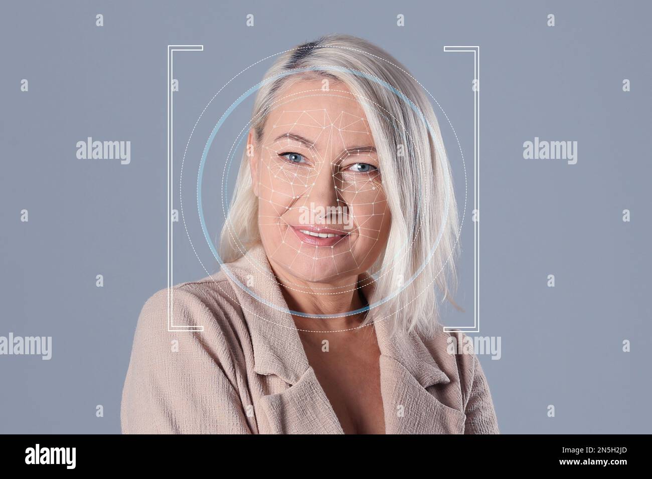 Facial recognition system. Woman with scanner frame and digital ...