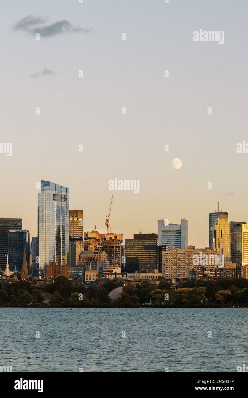 full moon over boston skyline at sunset charles river foreground Stock ...