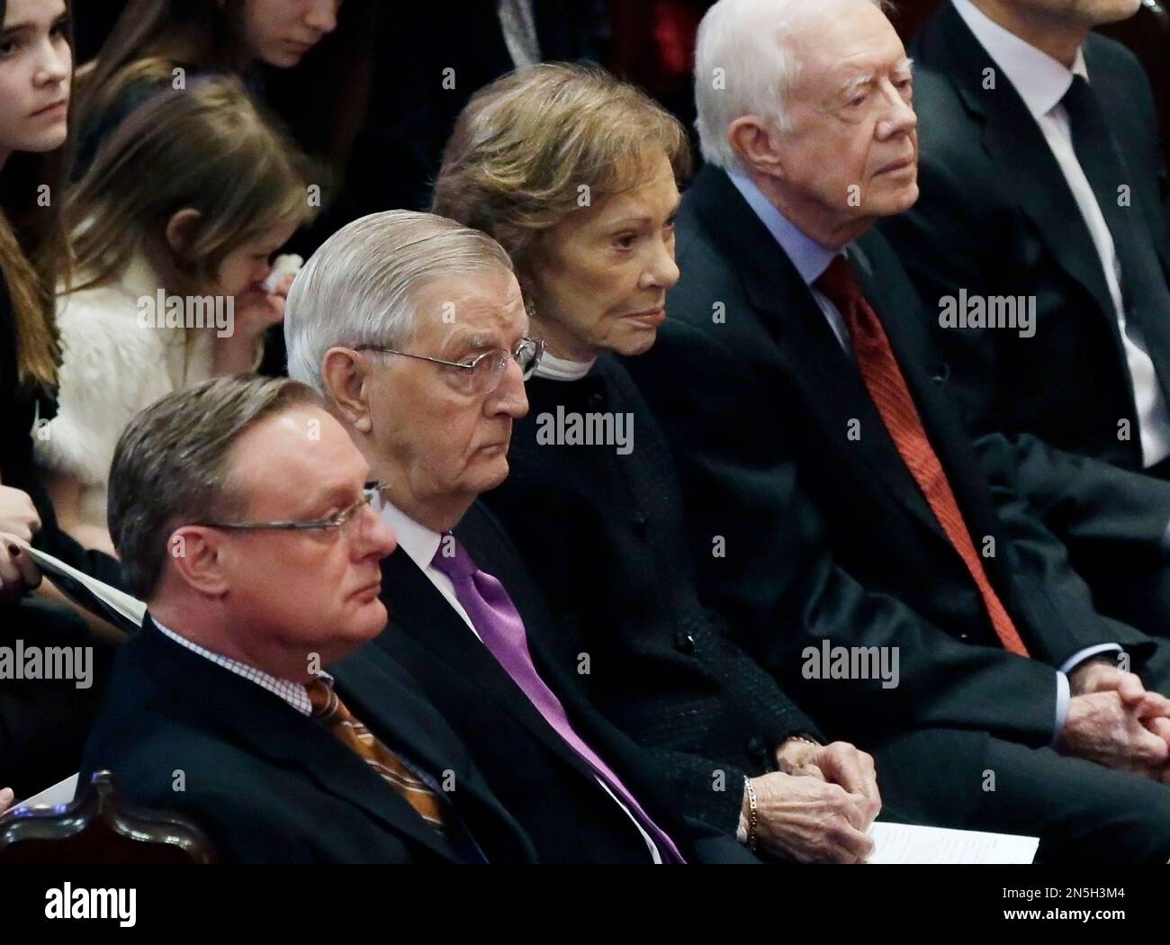 Former Vice President Walter Mondale, second from left, is accompanied ...