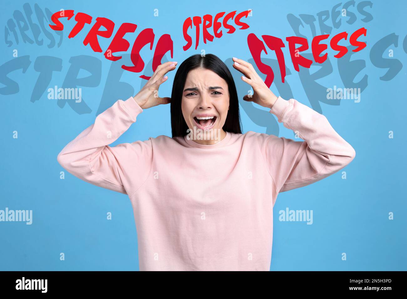 Stressed young woman and text on light blue background Stock Photo - Alamy