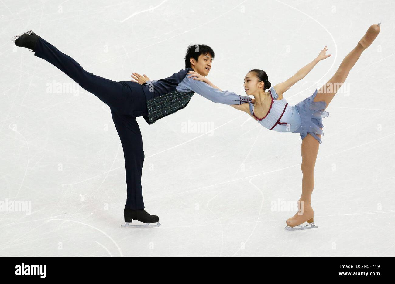Narumi Takahashi and Ryuichi Kihara of Japan compete in the team pairs ...