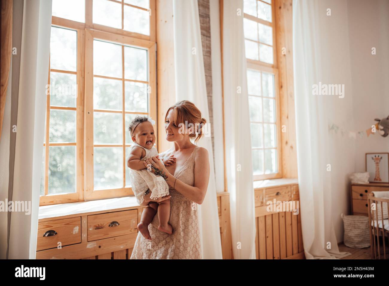 Diverse people portrait of mother with swarthy infant spending time at ...