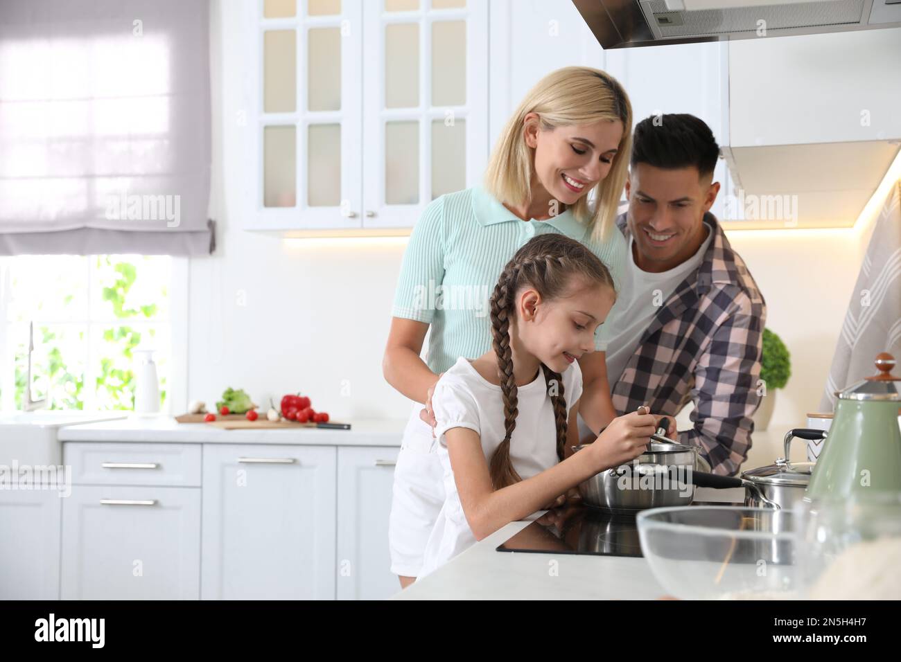 Mom cooking dinner for husband hi-res stock photography and images - Alamy