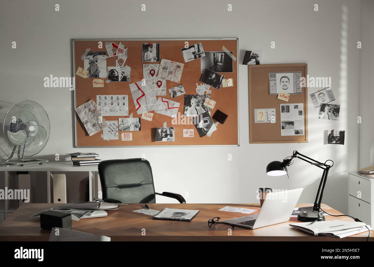 Detective office interior with big wooden desk and evidence board Stock ...