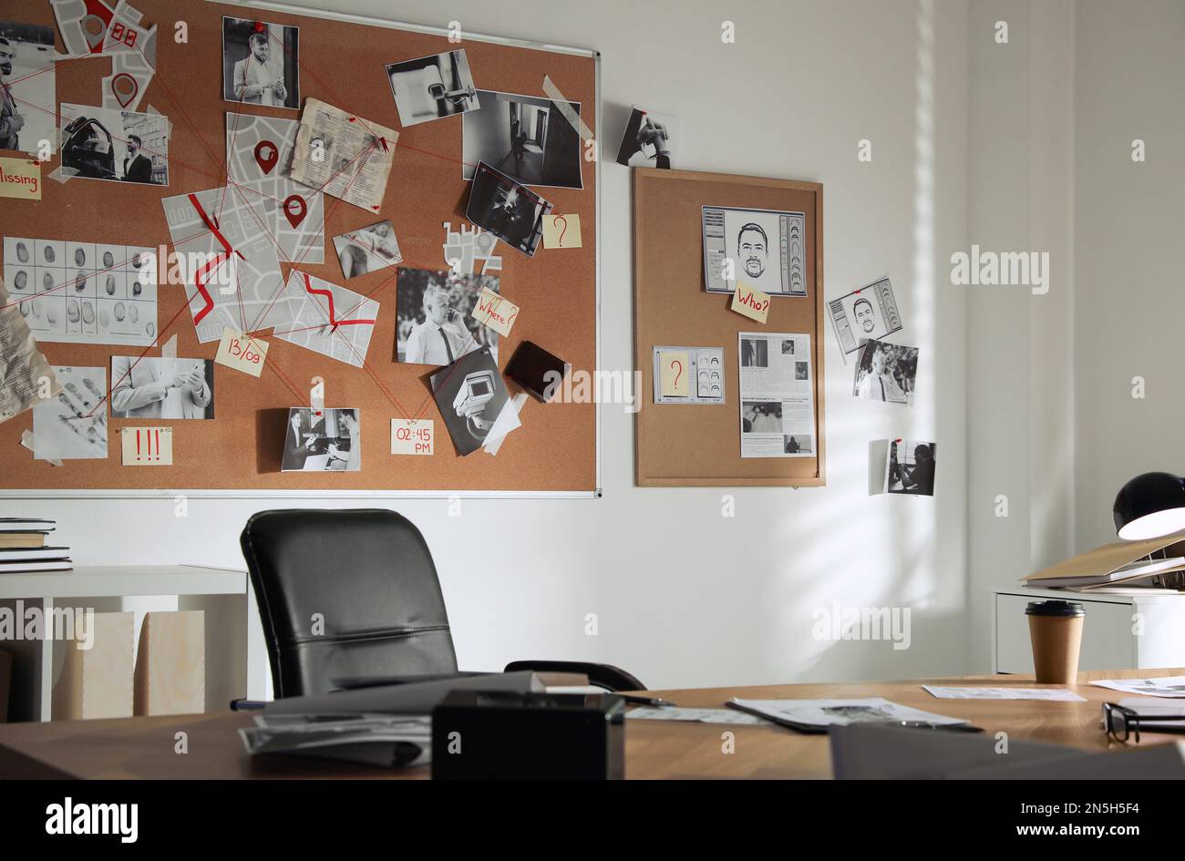Detective office interior with big wooden desk and evidence board Stock ...
