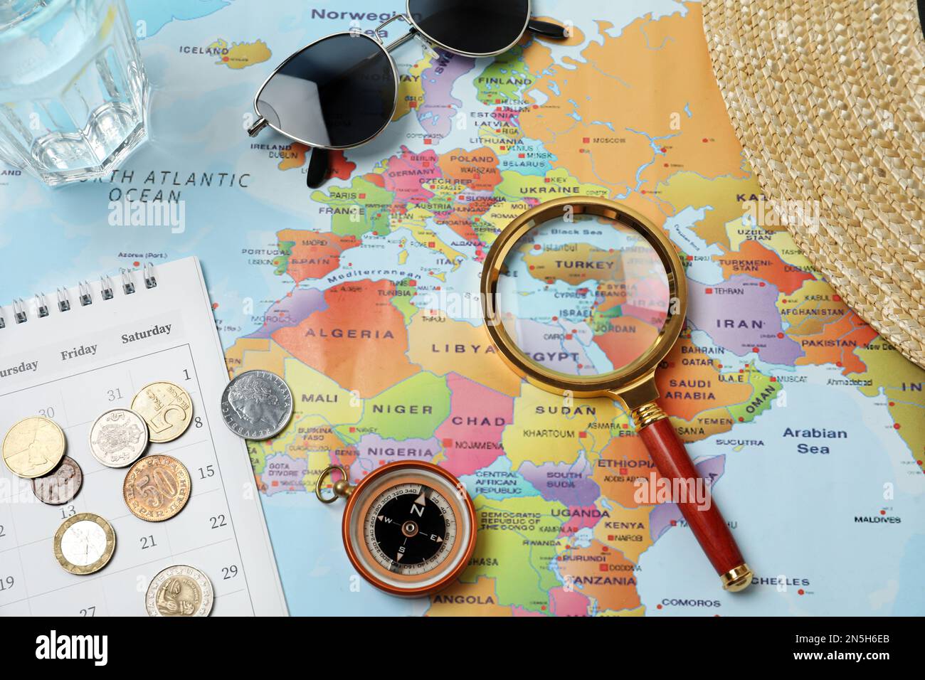 Flat lay composition with different travel accessories on world map ...