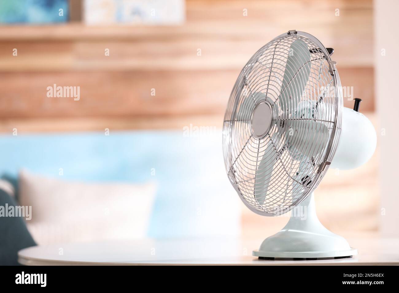 Modern electric fan on white table indoors. Space for text Stock Photo ...