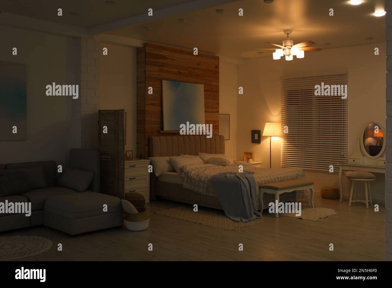 Stylish apartment interior with modern ceiling fan in evening Stock ...