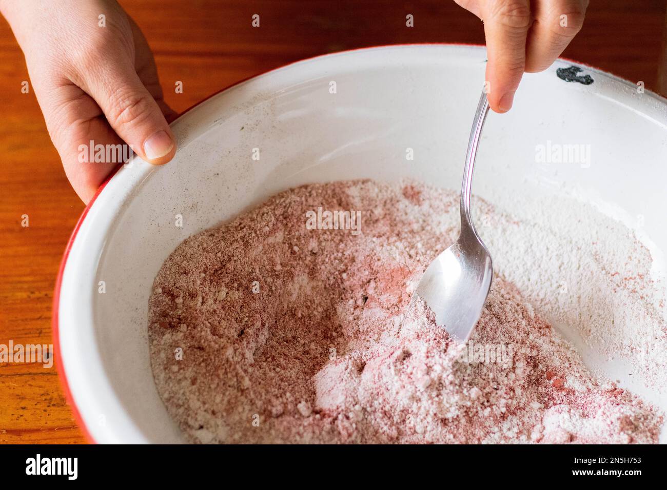Hands and spoon hi-res stock photography and images - Alamy