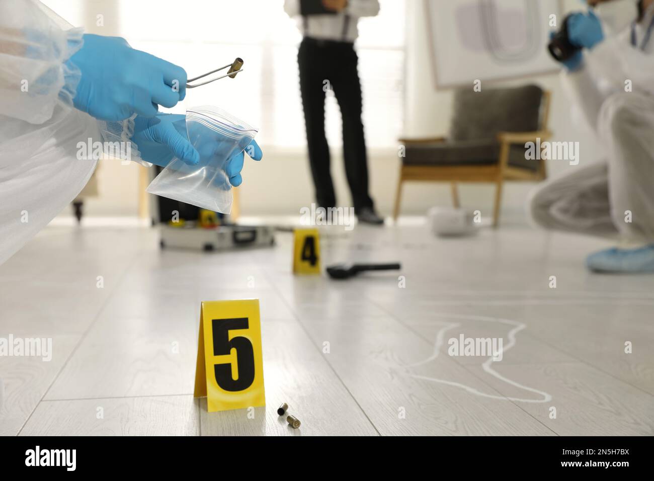 Investigators working at crime scene in messy room, closeup Stock Photo ...
