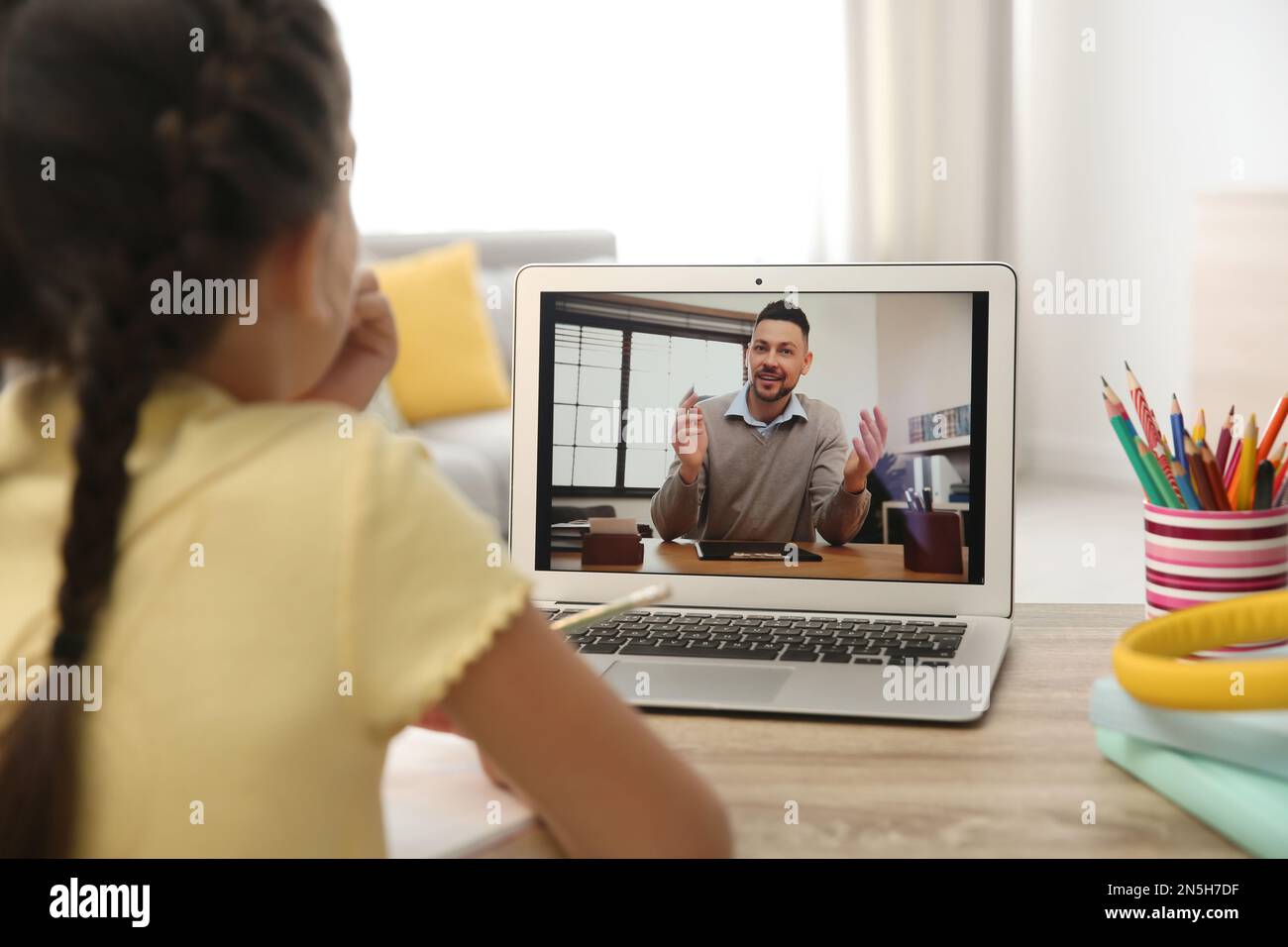 Distance learning, studying at home. Girl having online school lesson ...