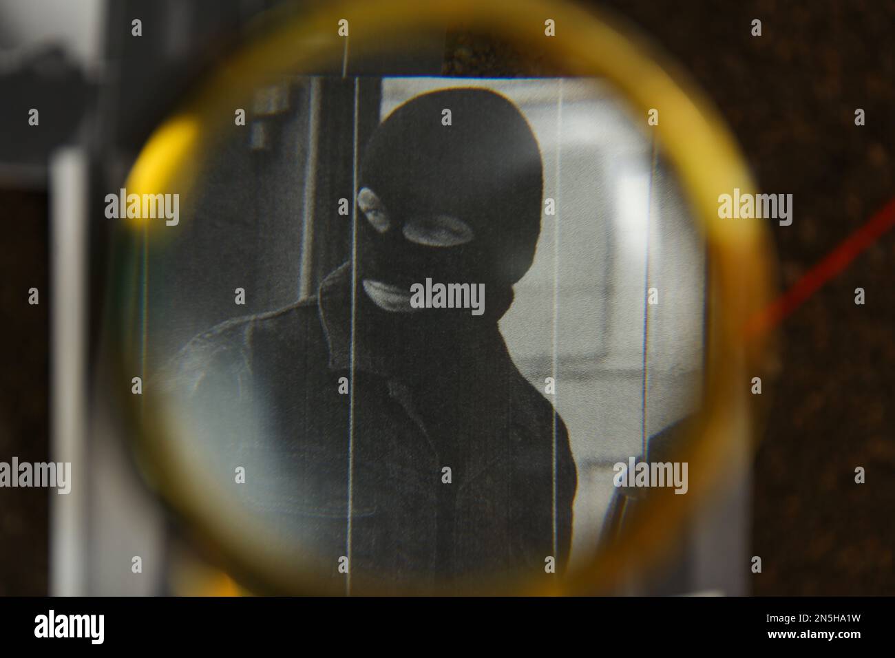 Looking at detective board through magnifying glass, closeup Stock ...
