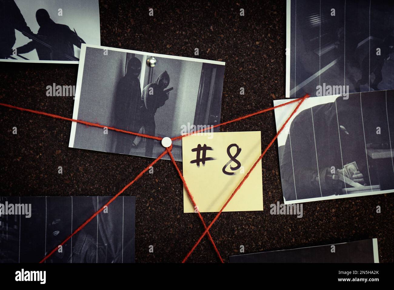 Detective board with crime scene photos, sticker, clues and red thread ...