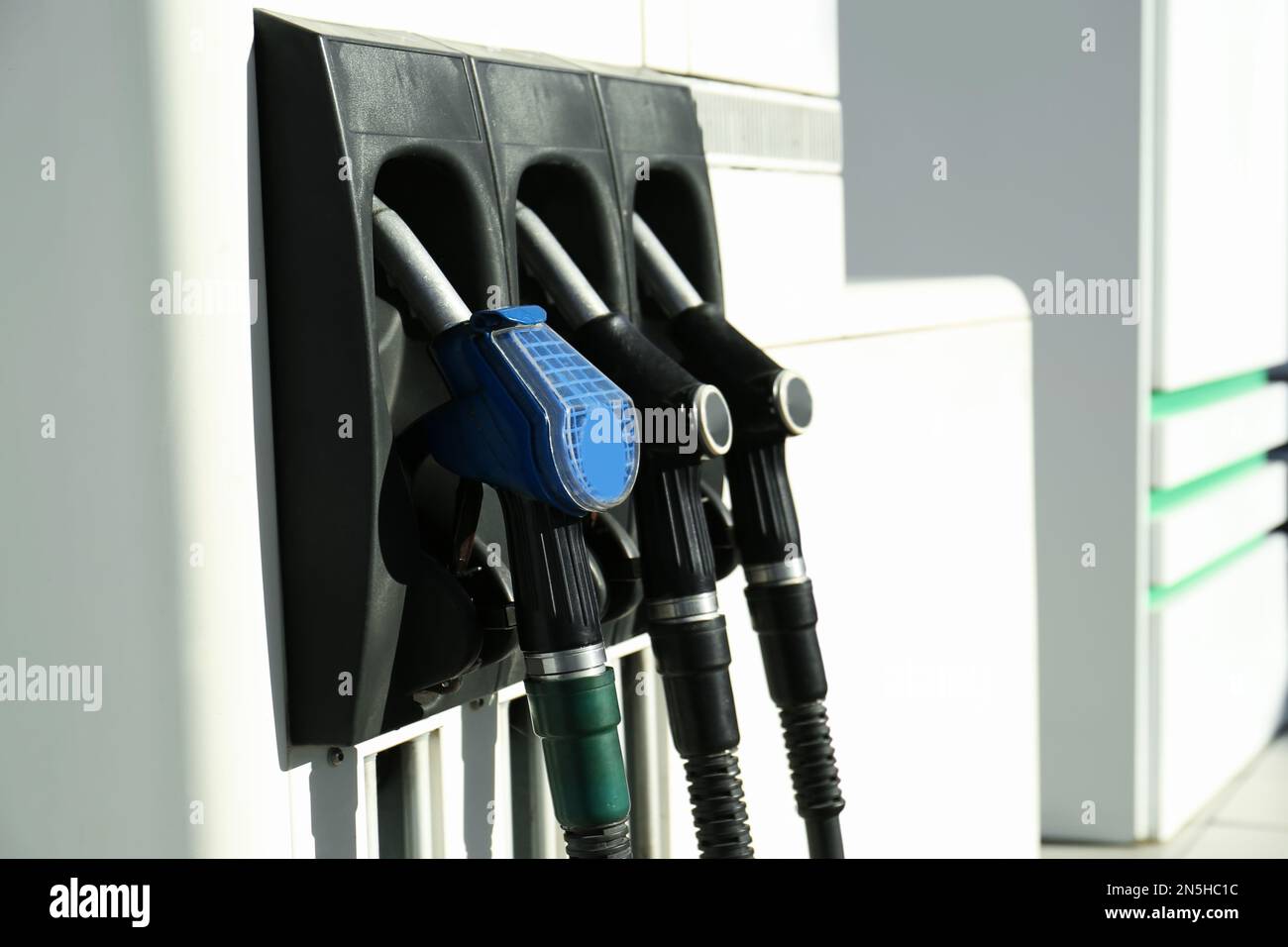 Petrol pump filling nozzles at gas station Stock Photo - Alamy