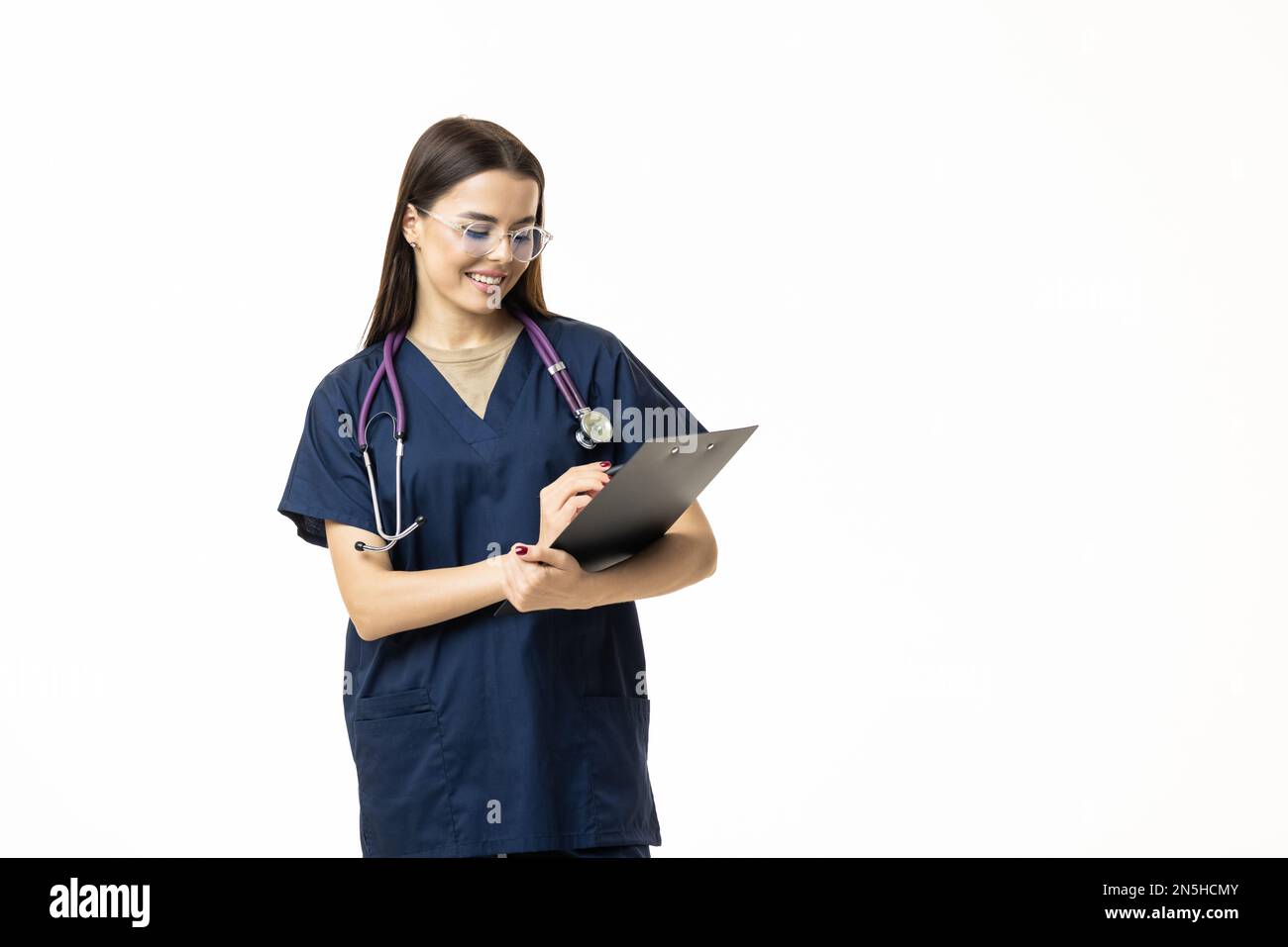 Woman write on report on white background Stock Photo - Alamy