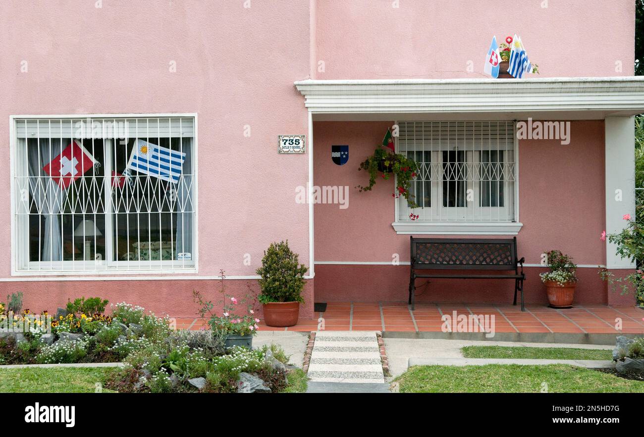 House with a shield hanging from the facade that indicate the Swiss ...