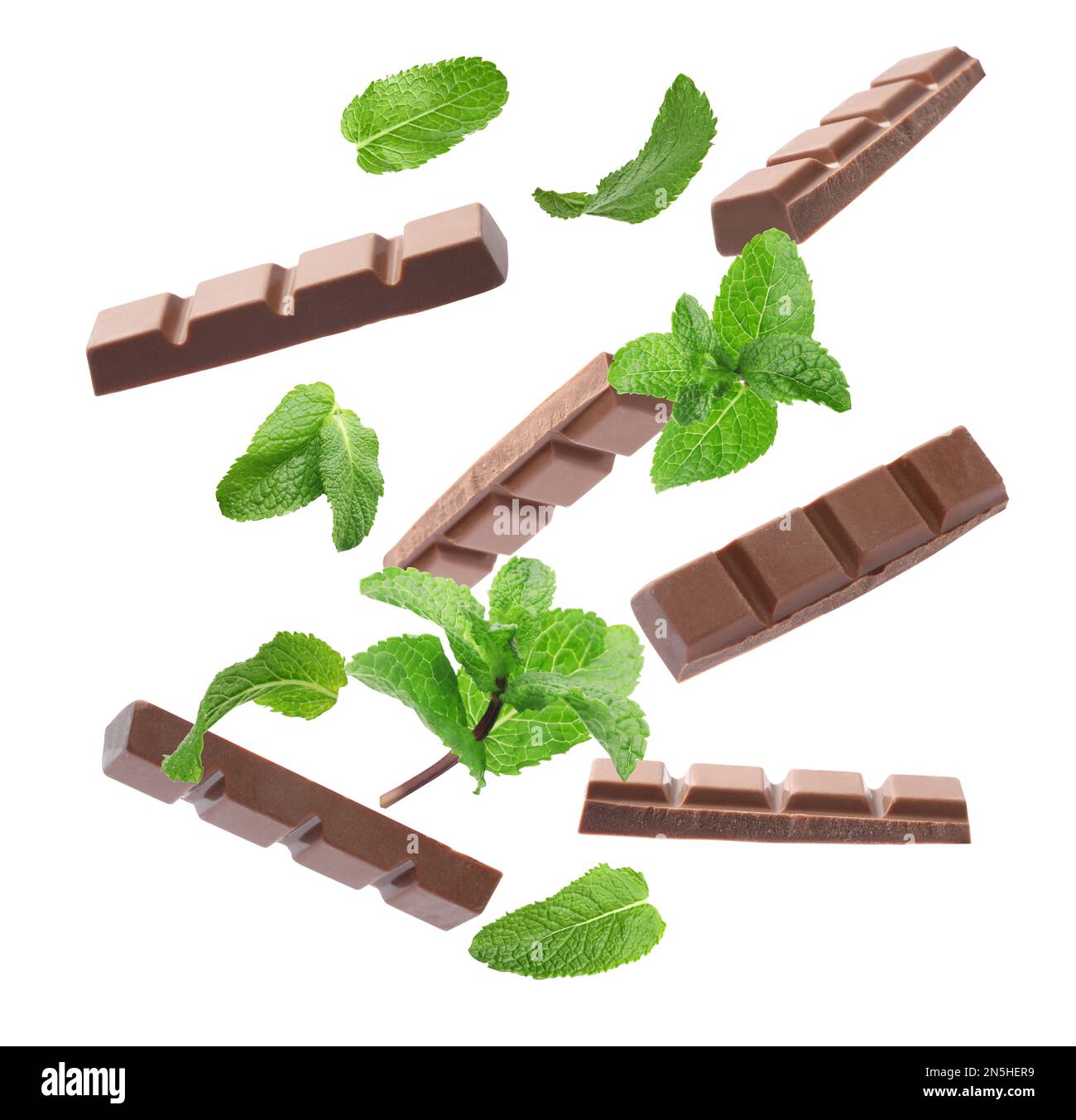 Milk chocolate pieces and mint falling on white background Stock Photo ...