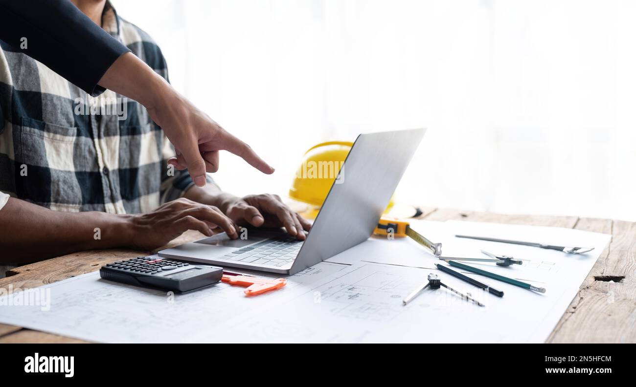 In engineering bureau engineers discussing technical construction Stock Photo - Alamy