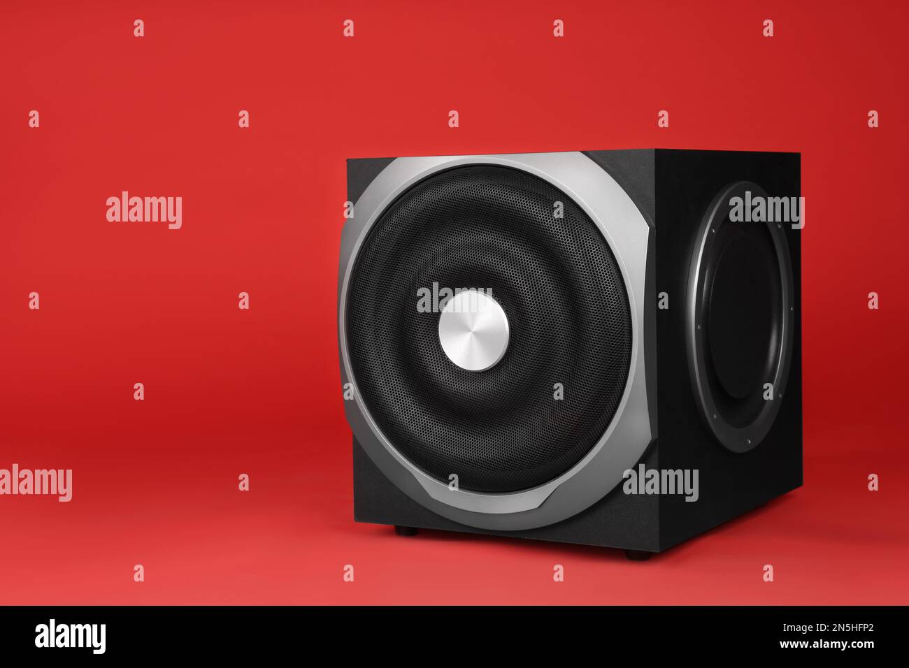 Modern subwoofer on red background. Powerful audio speaker Stock Photo ...